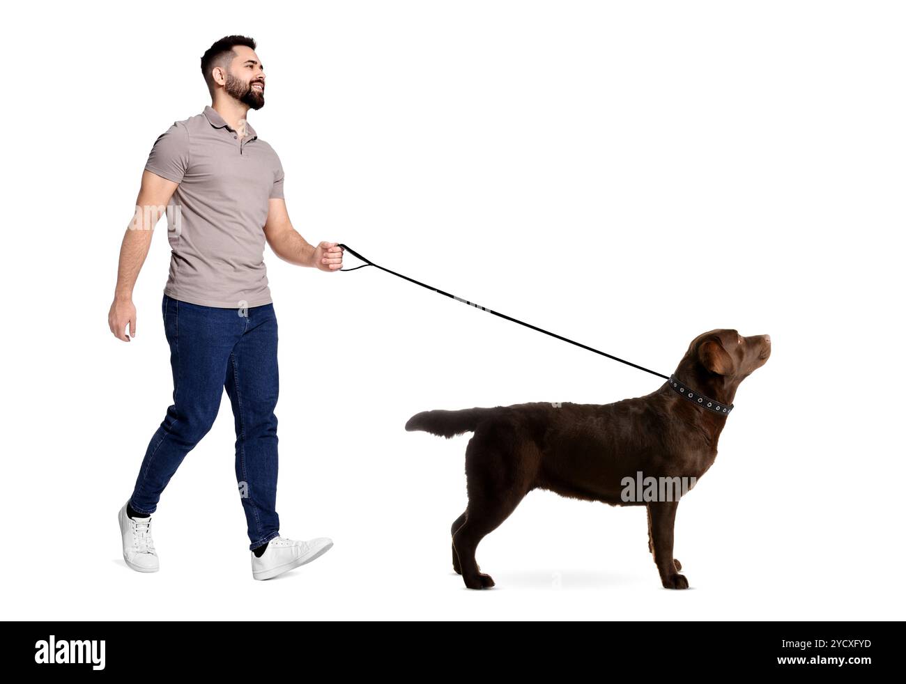 Happy man walking his dog on white background Stock Photo - Alamy