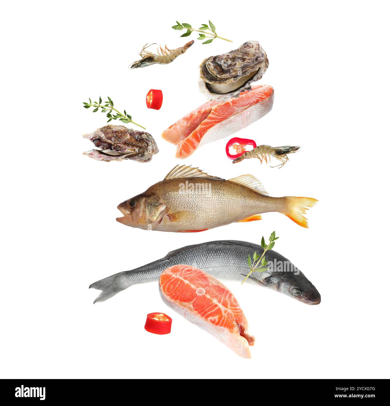 Different sea food in air on white background Stock Photo - Alamy