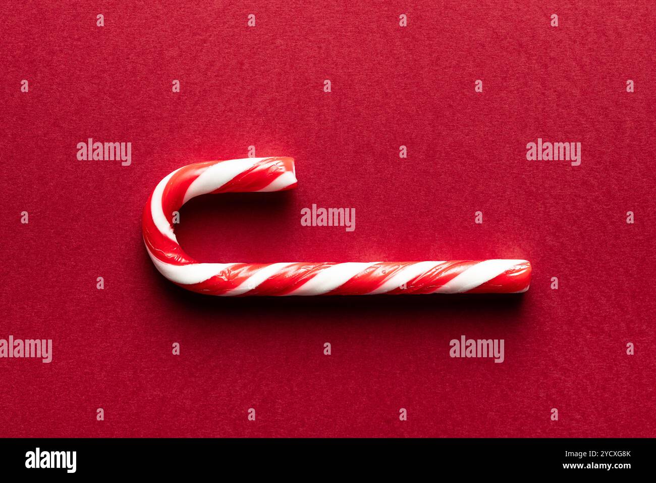 Top view of a traditional candy cane with red and white stripes ...