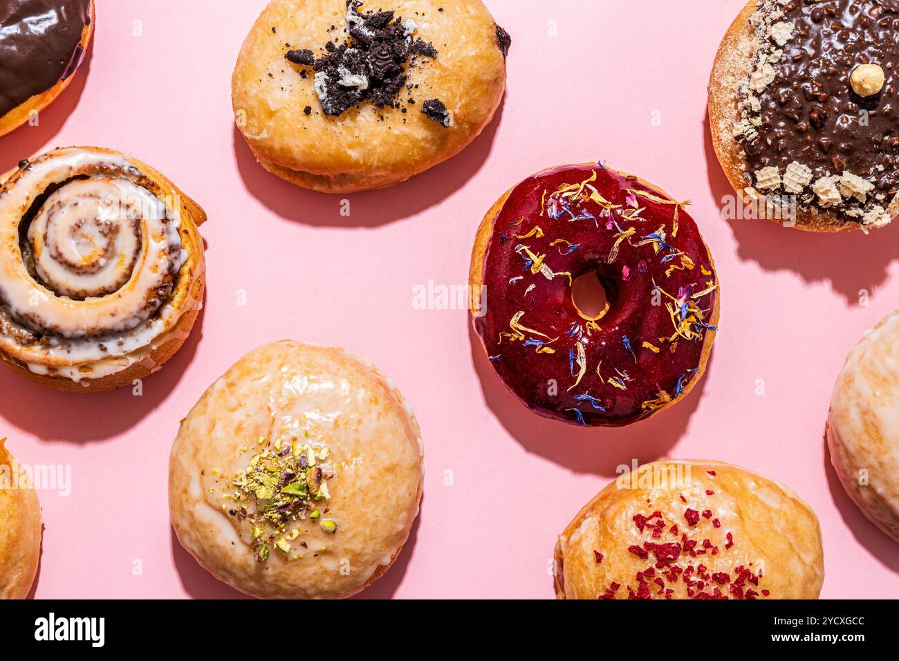 Vegan donuts and pastries, including cinnamon rolls and donuts filled ...