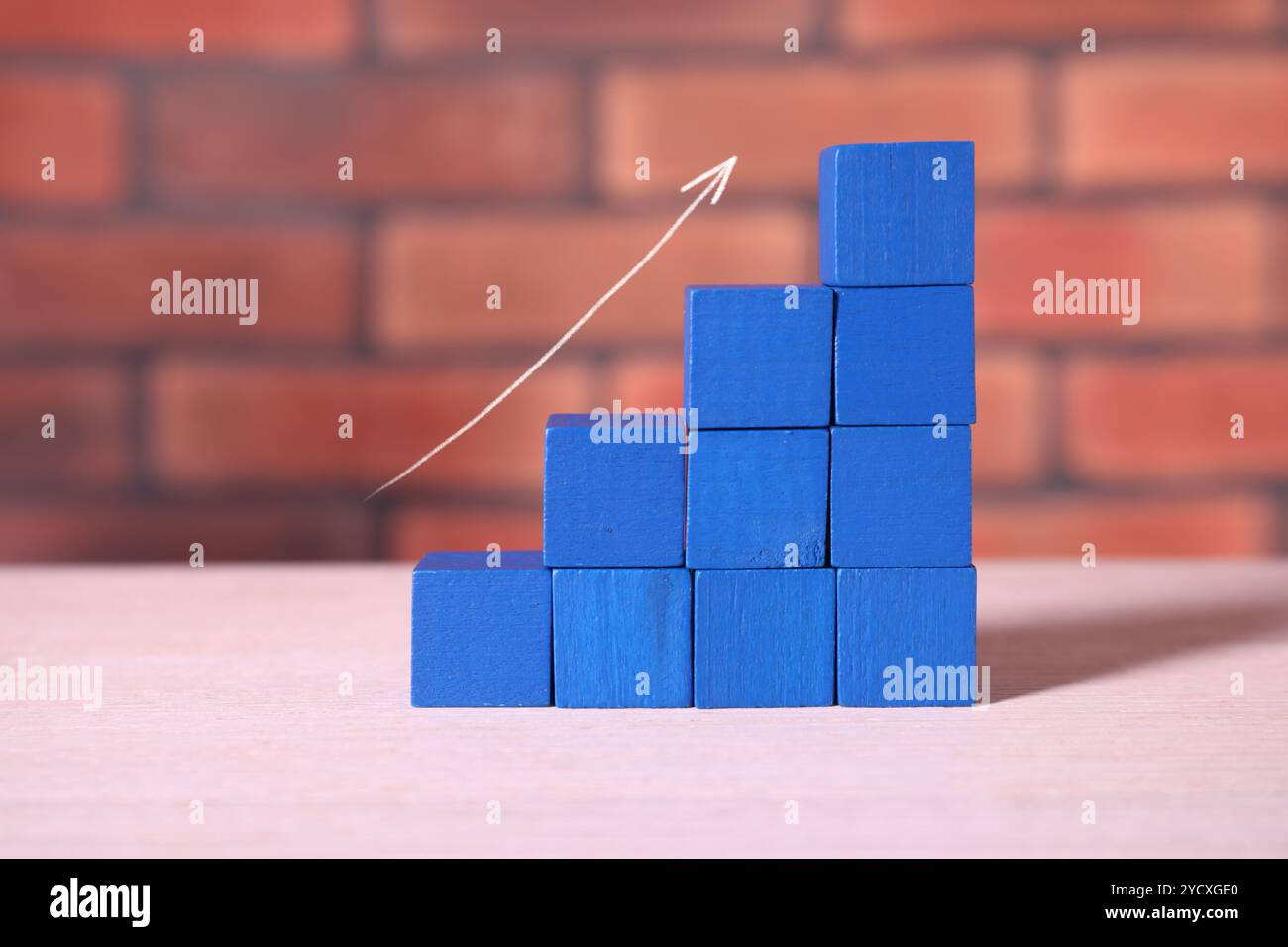 Stair of blue cubes and arrow on pink table. Step-by-step concept Stock ...