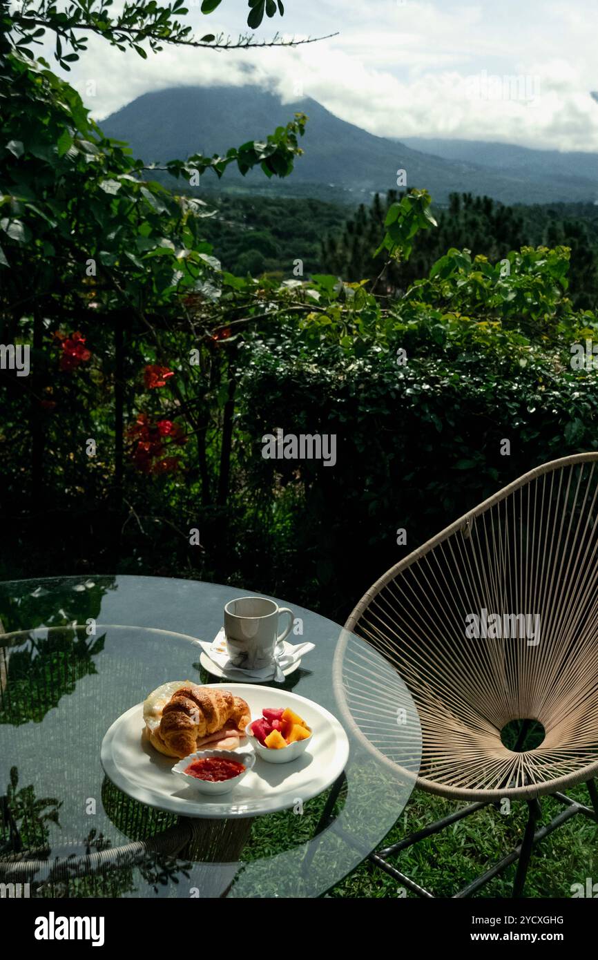 Enjoy breakfast outdoors with a serene view of a volcanic mountain in ...