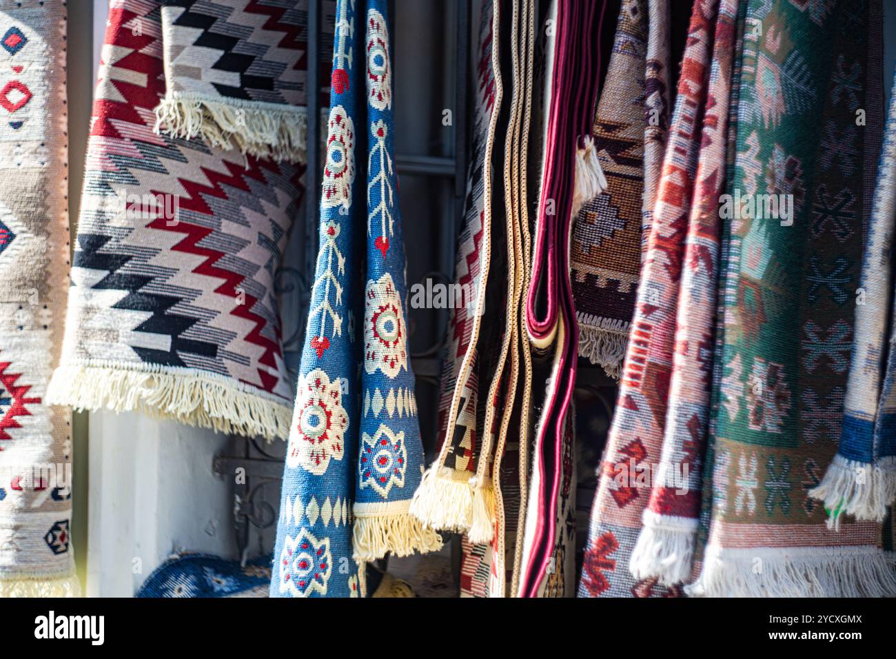A vibrant display of traditional Georgian carpets, featuring intricate ...