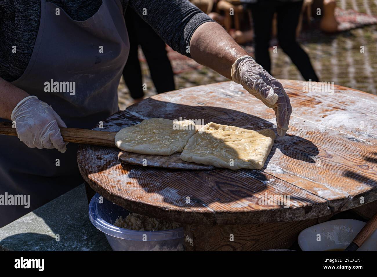 An open-air display of traditional Georgian street food preparation ...