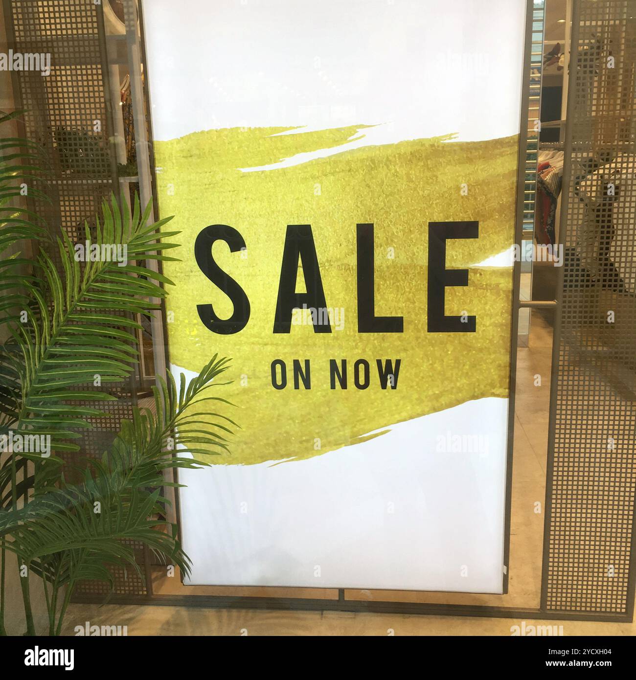 Sale signage in shopfront window Stock Photo - Alamy