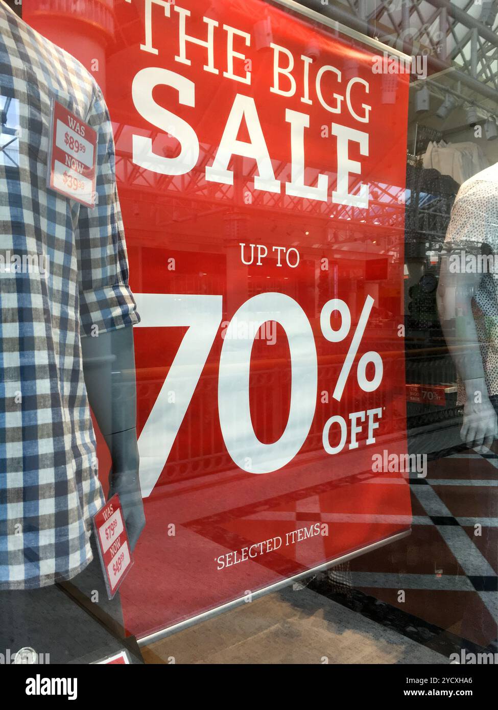 Mens fashion boutique Sale Sign showing markdowns up to 70% in shop ...