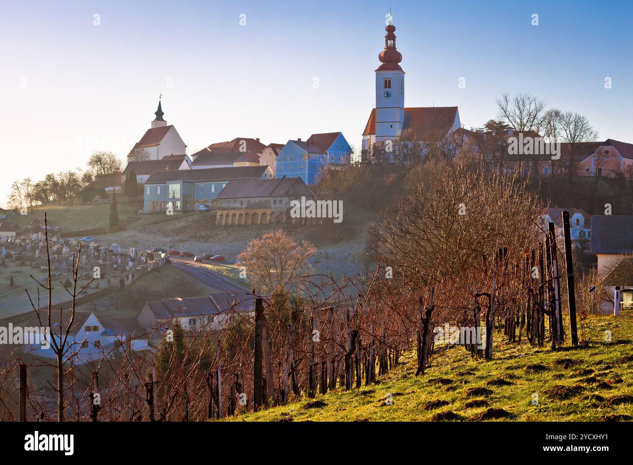 Straden village in fog church on the hill Stock Photo - Alamy