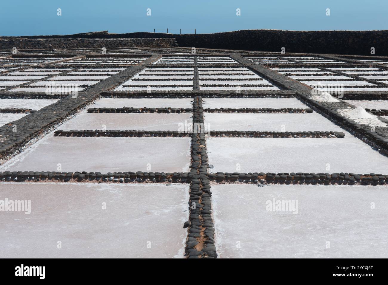 Aerial view of salt pans in a geometric layout, used for the ...