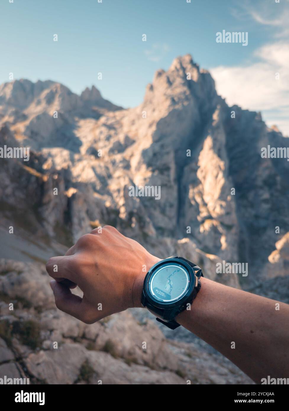 A close-up view of anonymous hiker's hand wearing a smartwatch ...