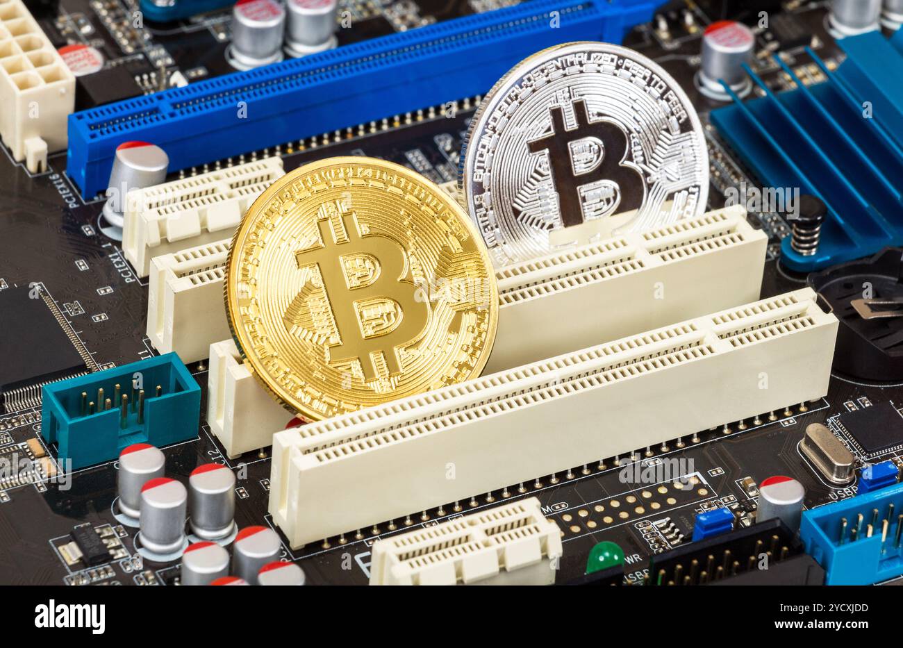 Coins of Cryptocurrency lying over electronic computer component ...
