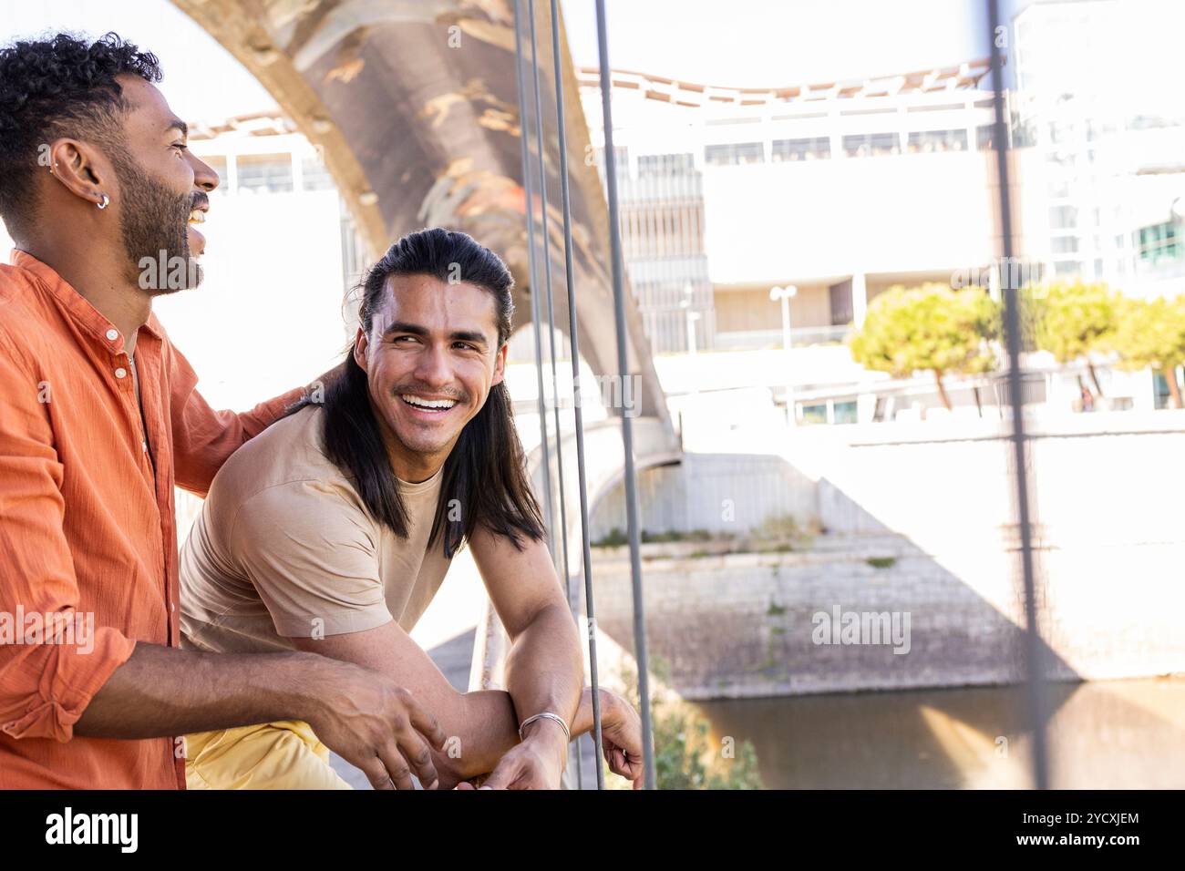 A joyful moment captured between a gay couple, showcasing their ...