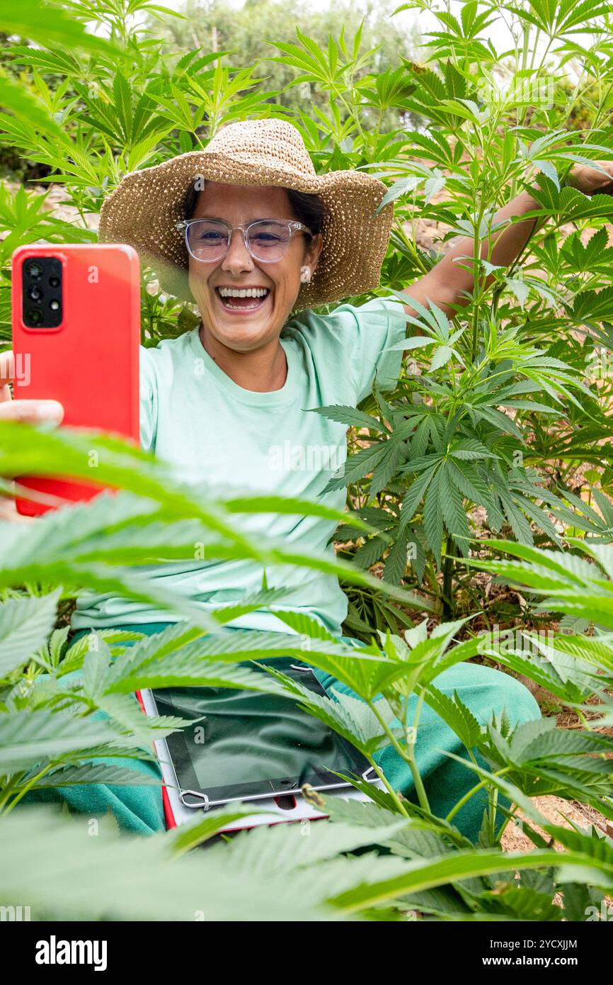 Amidst lush cannabis plants hi-res stock photography and images - Alamy