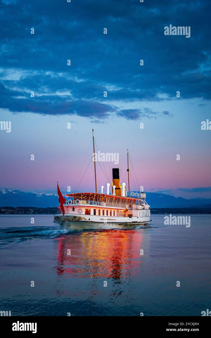 A classic paddle steamer boat sails on Lake Leman, Lake Geneva near ...