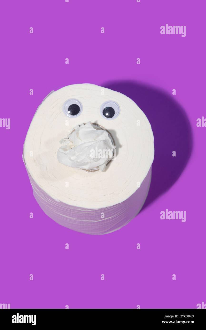 A roll of white toilet paper with googly eyes and a mouth, creating a ...