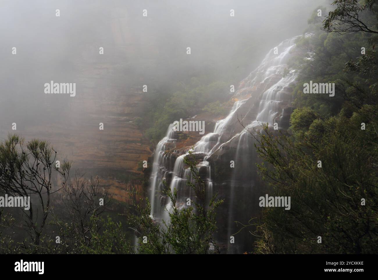 Blue Mountains and waterfall in heavy fog Stock Photo - Alamy