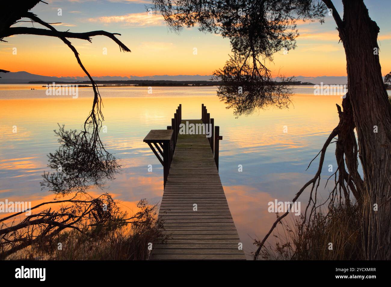 Rustic jetty sunrise Stock Photo - Alamy