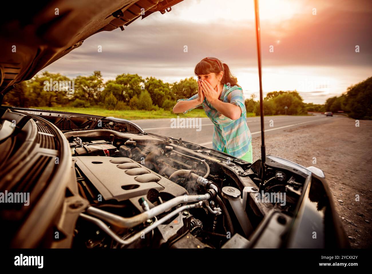Damage to vehicle problems on the road Stock Photo - Alamy