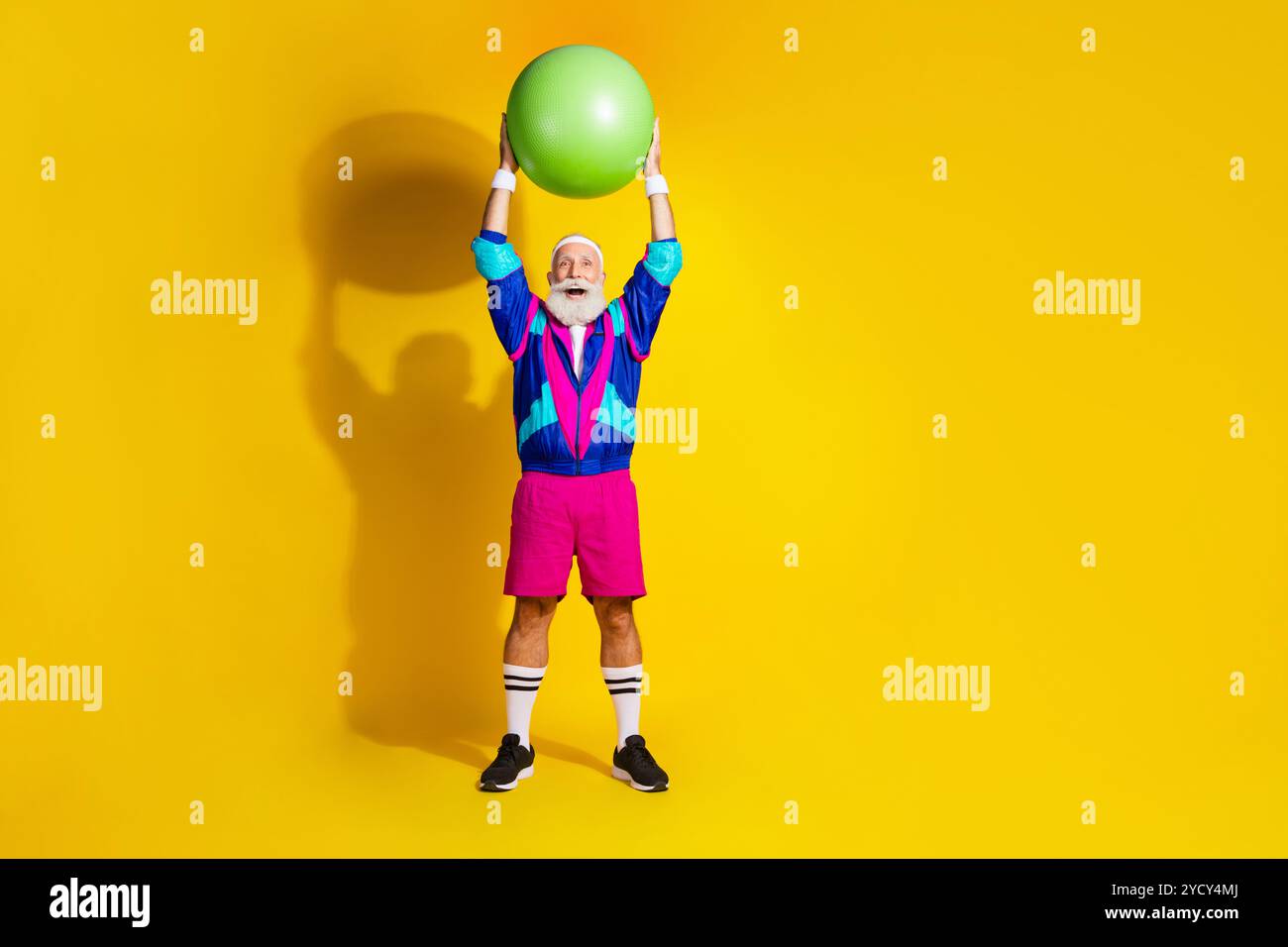 Full length photo of cheerful positive mature guy dressed retro sport ...