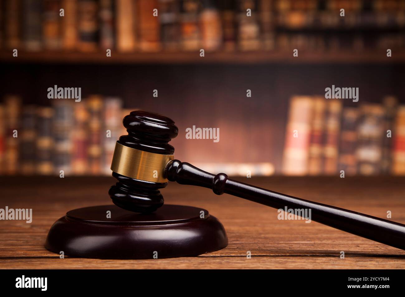 Law books, mallet of the judge, Courtroom background Stock Photo - Alamy