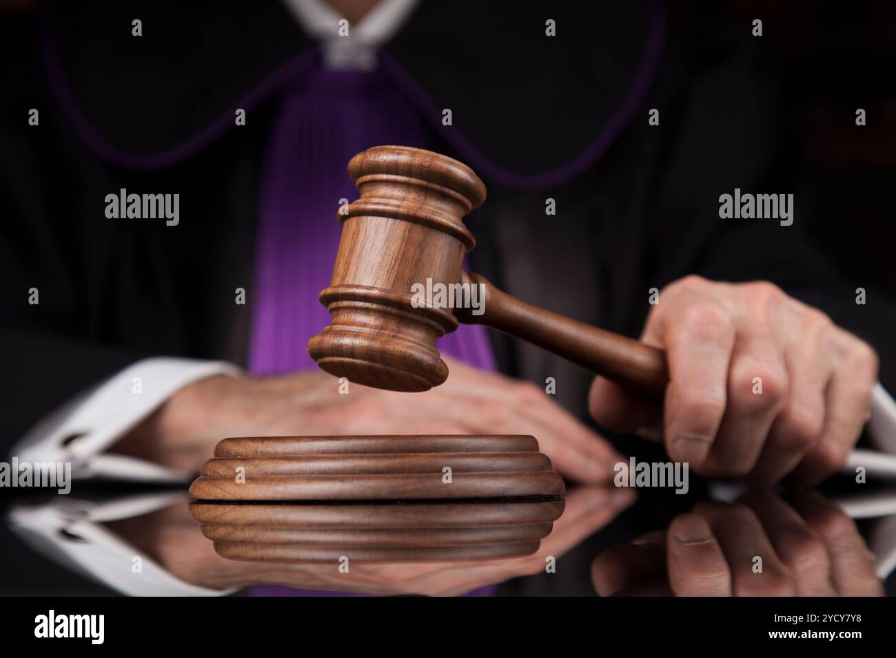 Judge, male judge in a courtroom striking the gavel Stock Photo - Alamy