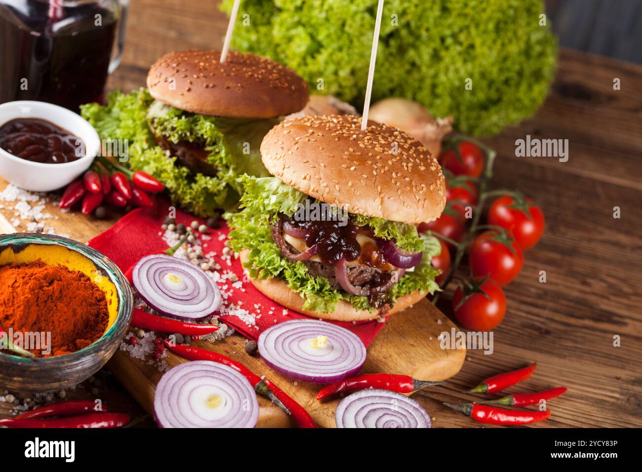 Fresh burger closeup on wooden desk background Stock Photo - Alamy