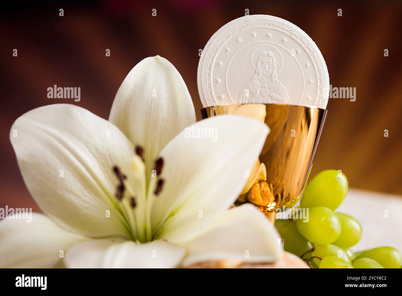 Symbol christianity religion a golden chalice with grapes and bread ...