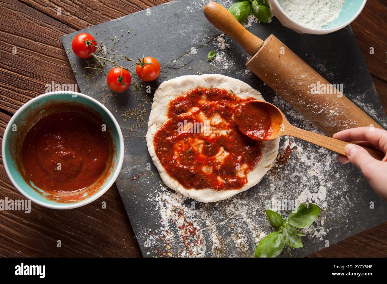 Homemade Italian pizza preparation Stock Photo - Alamy