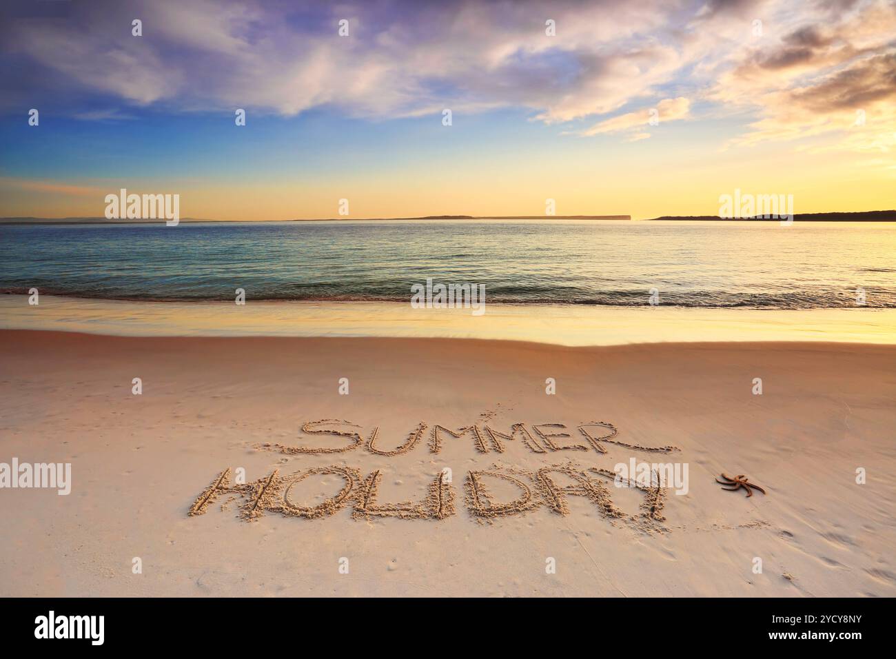Summer Holiday etched into the sand of beach Stock Photo - Alamy