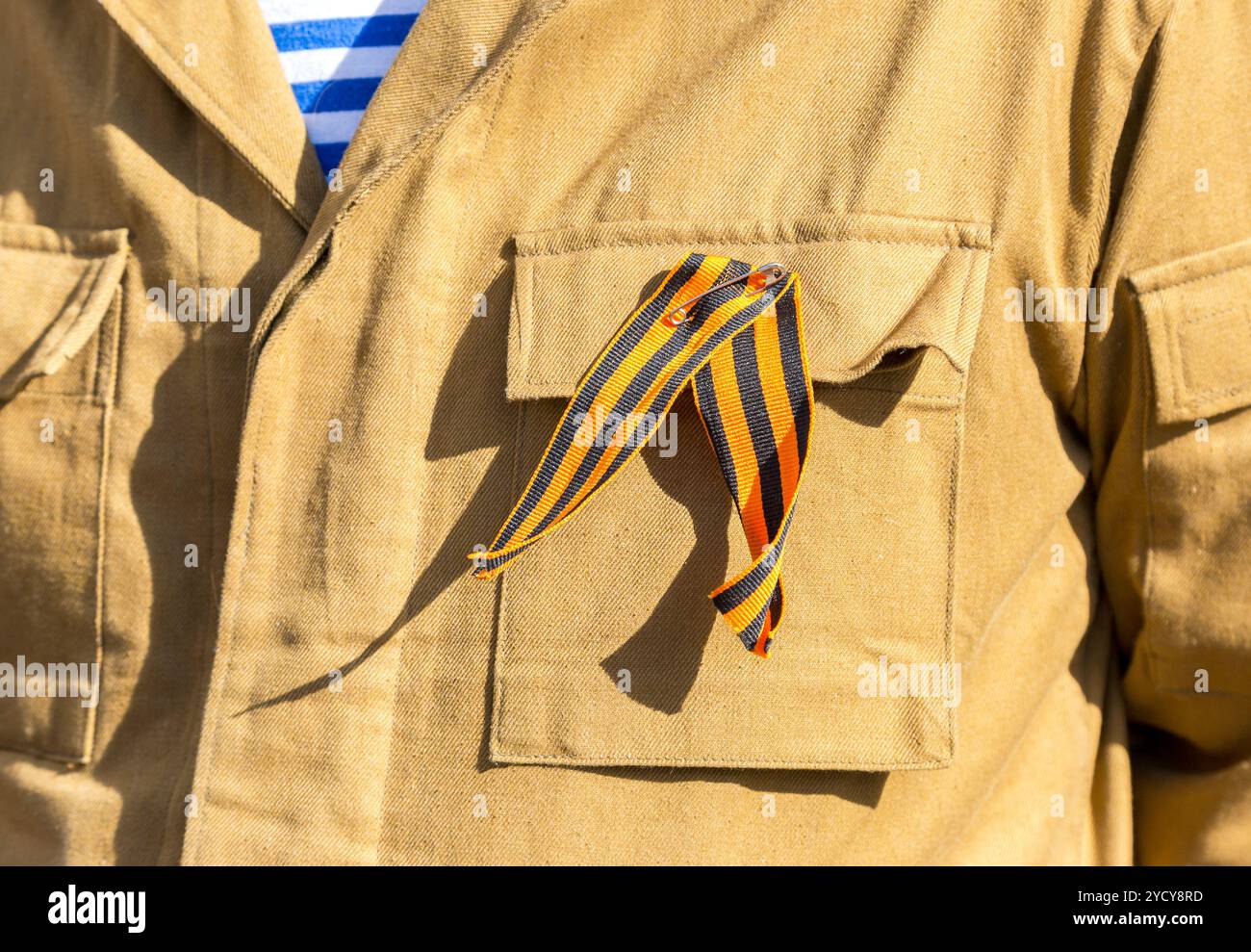 Black and orange ribbon of St. George on a veteran military uniform ...