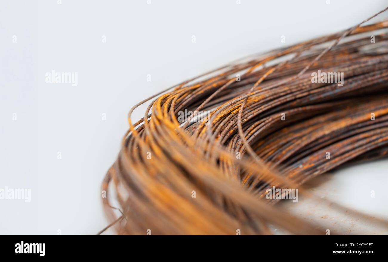 Rusty coil of wires captured up close on a light background Stock Photo ...