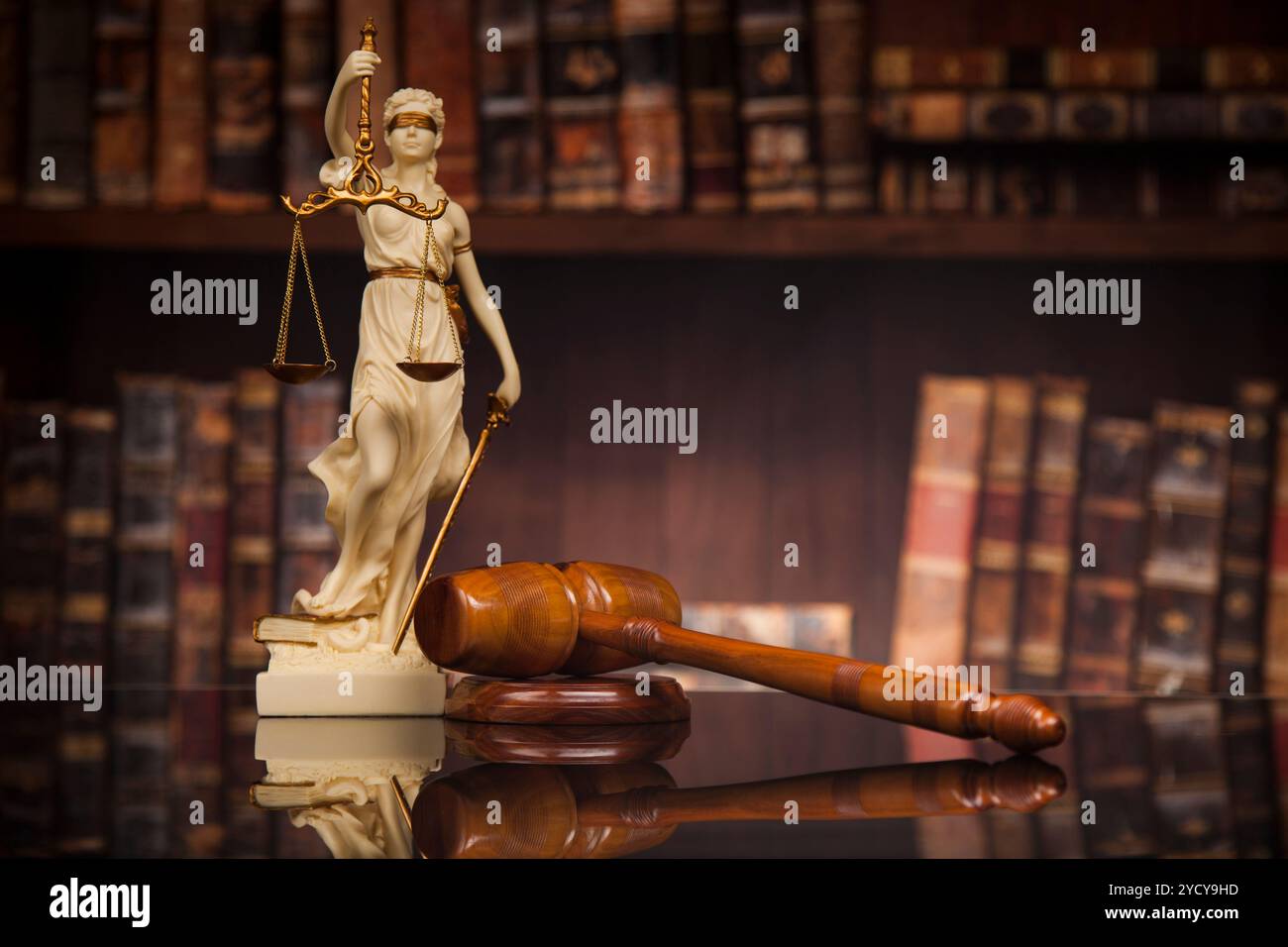 Antique statue of justice, law, books background Stock Photo - Alamy