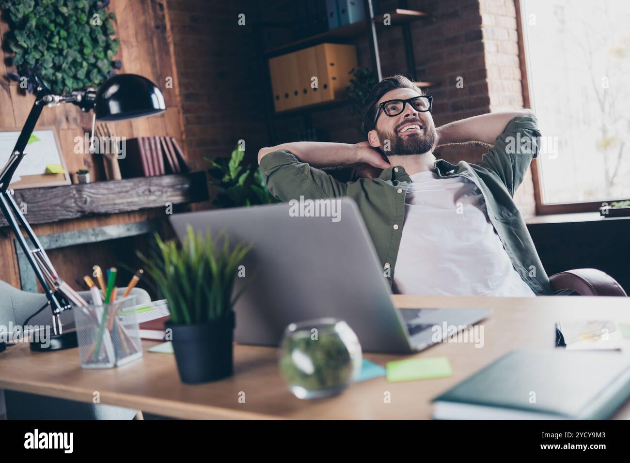 Photo of confident cool boss wear shirt arms behind head having rest ...