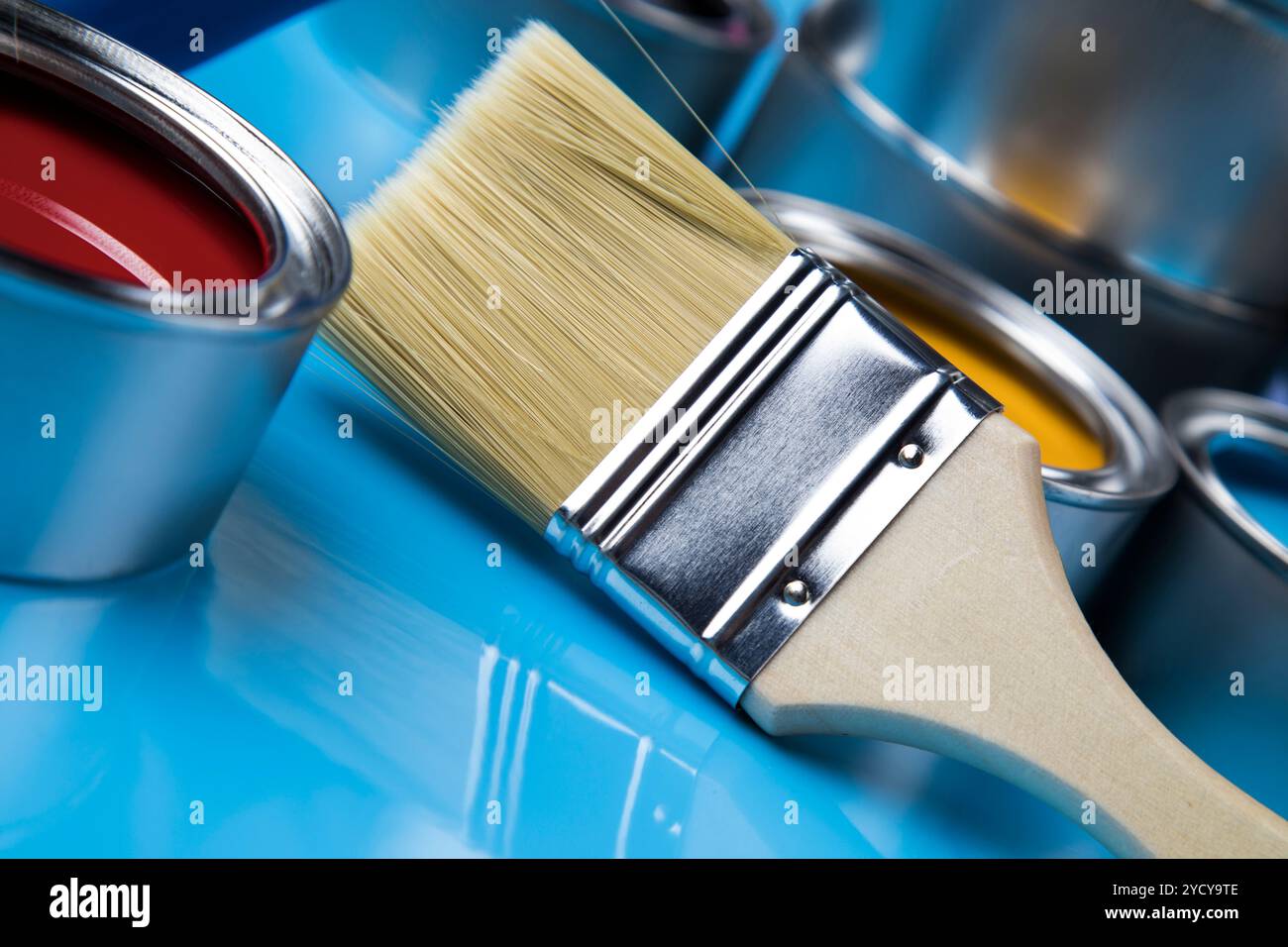 Paint brush, tin can and color guide samples Stock Photo - Alamy