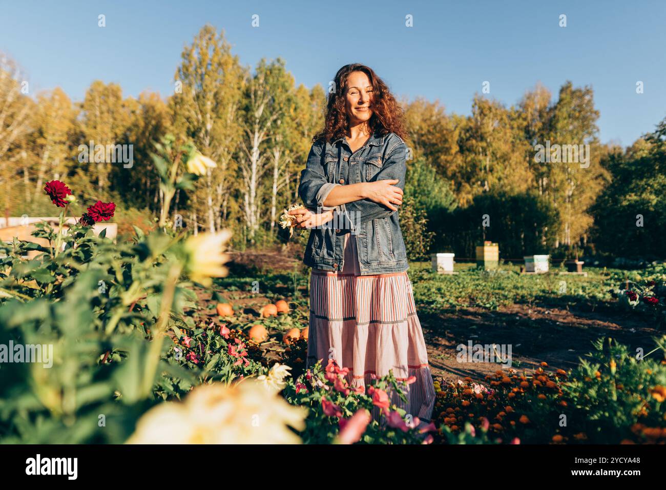 Woman gardener embracing the beauty of nature on her sustainable ...