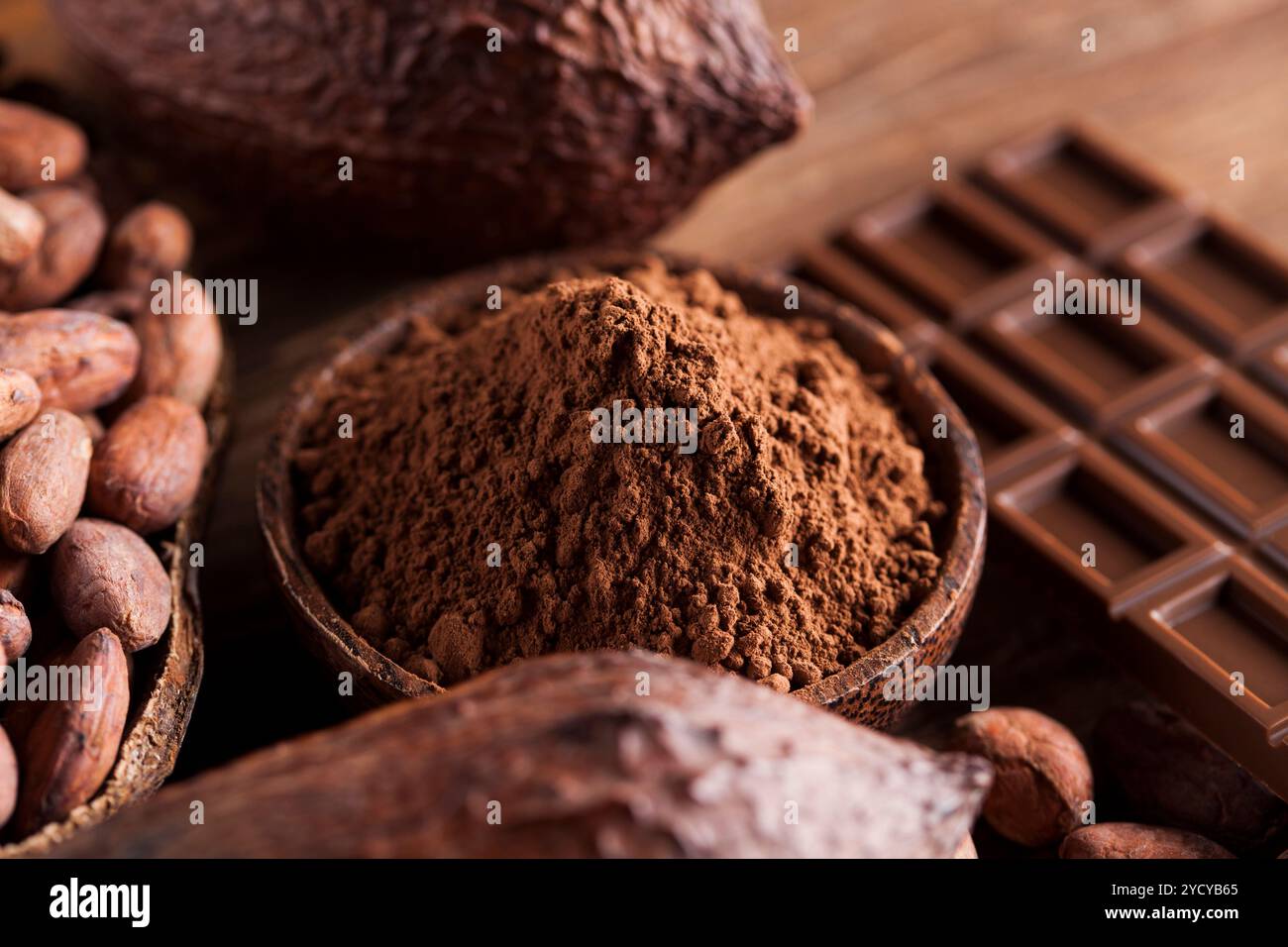 Chocolate bar, candy sweet, cacao beans and powder on wooden background ...