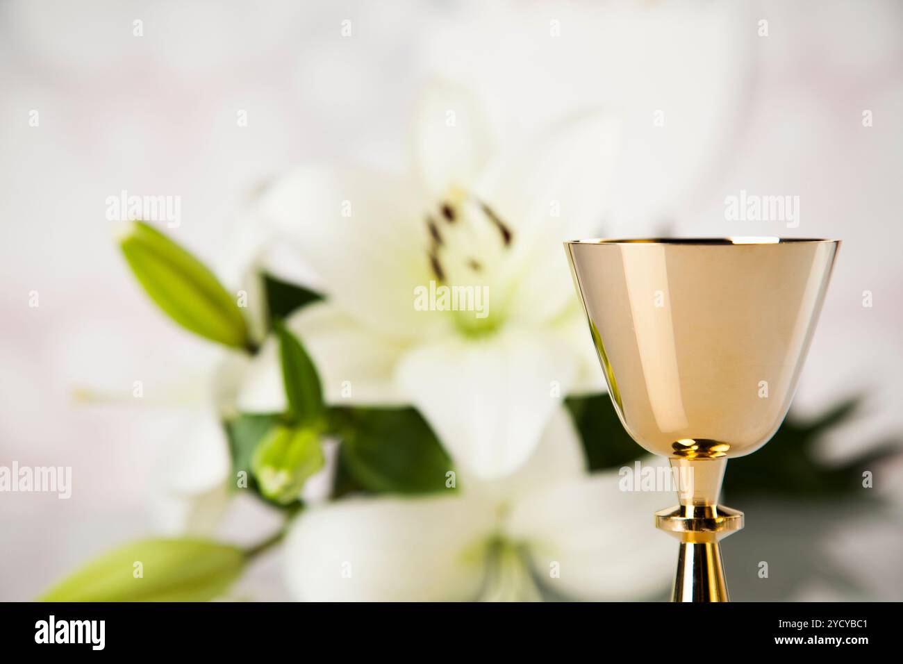 Holy communion a golden chalice with grapes and bread wafers Stock ...