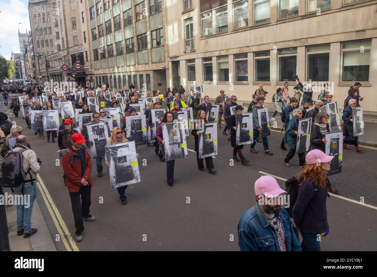 London, UK. 24 Oct 24. Marchers with pictures of political prisoners ...