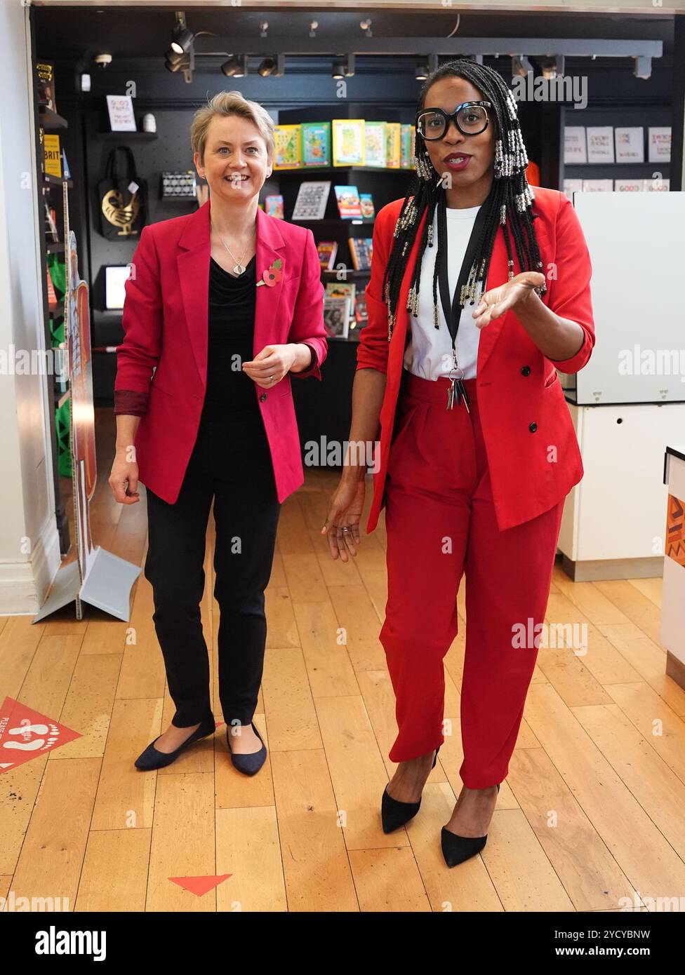 Home Secretary Yvette Cooper, with Director Lisa Anderson, during a ...