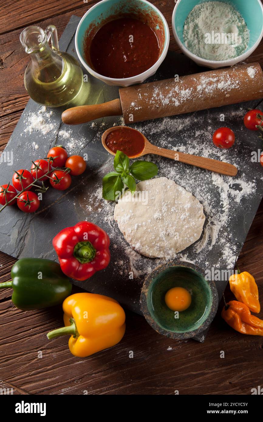 Fresh an tasty homemade pizza preparation Stock Photo - Alamy