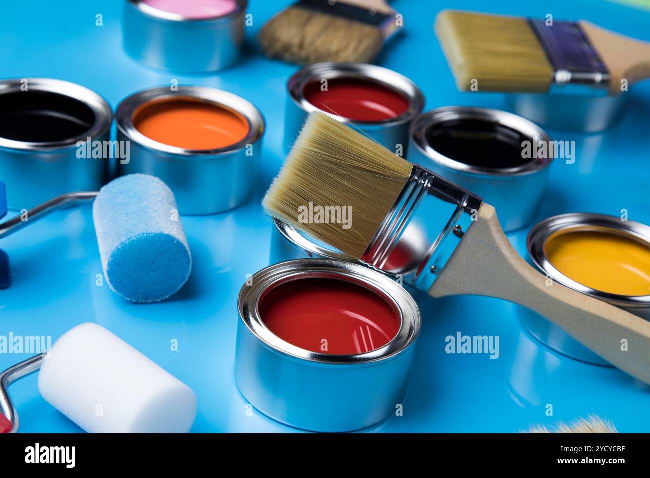 Paint brush, tin can and color guide samples Stock Photo - Alamy