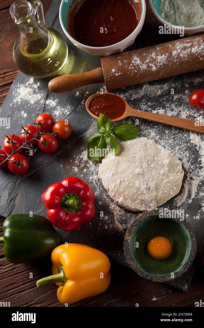 Homemade Italian pizza preparation Stock Photo - Alamy