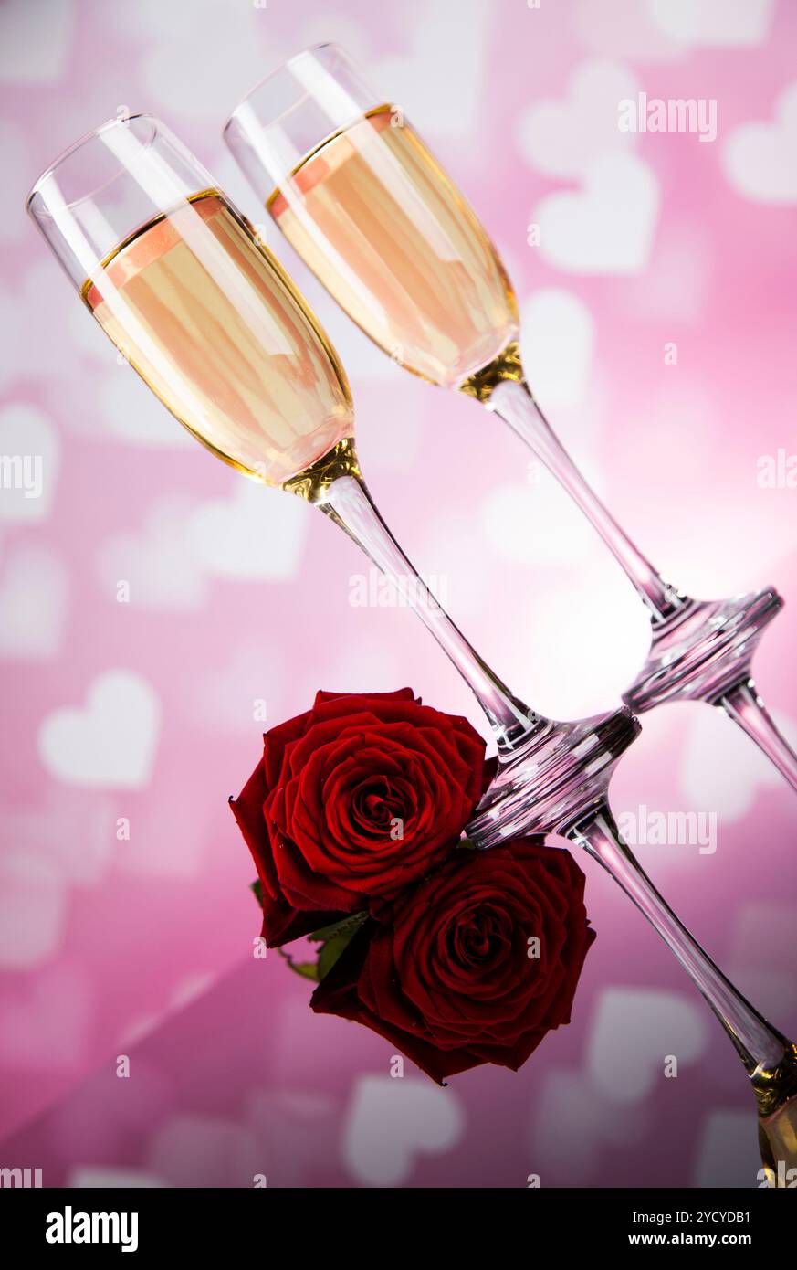 Champagne with Valentines day background and roses, mirror background ...