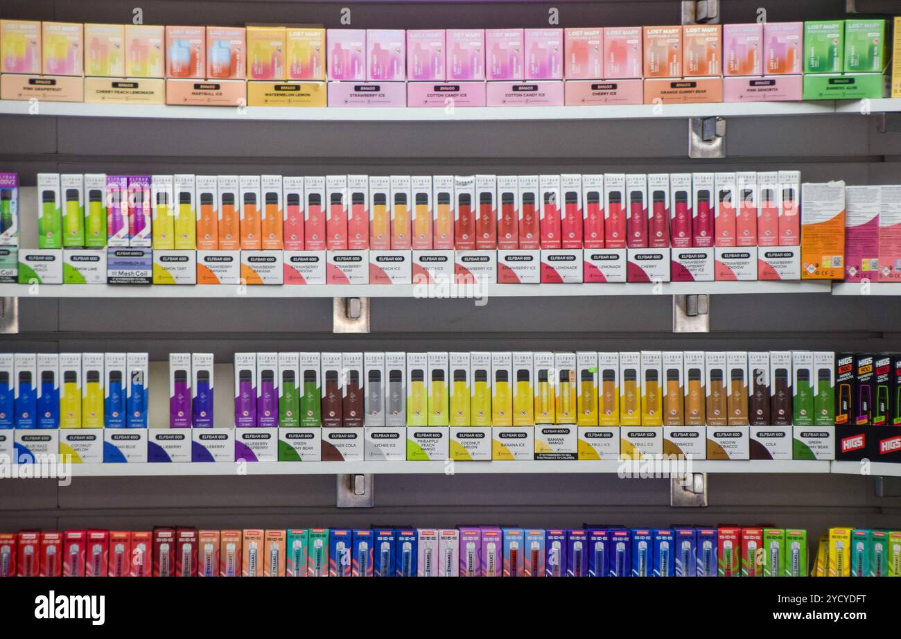 London, UK. 24th October 2024. Colourful vapes on display at a store in ...