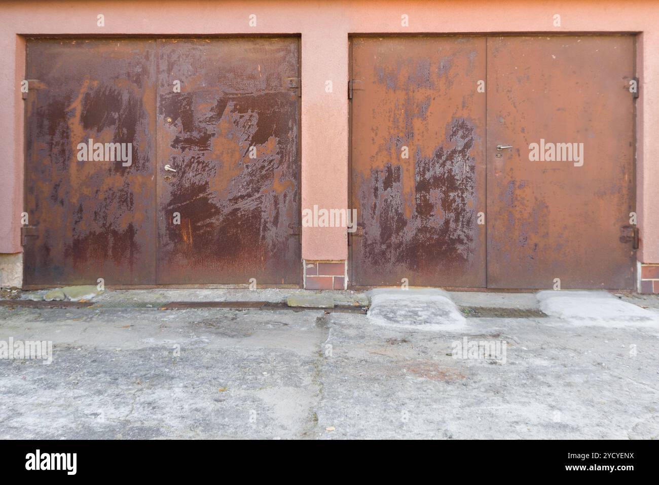 Two rusted metal doors with weathered surface Stock Photo - Alamy