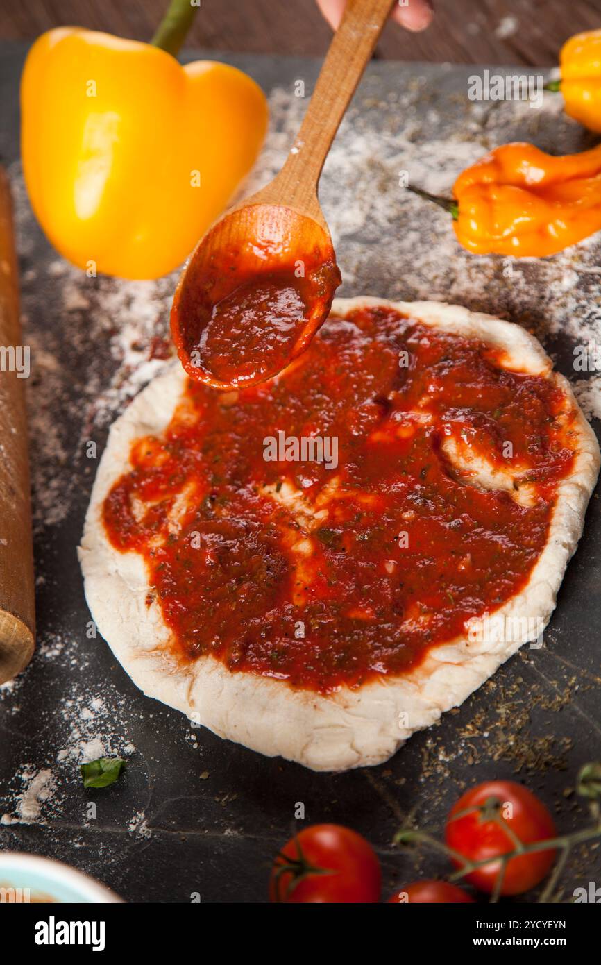 Homemade Italian pizza preparation Stock Photo - Alamy