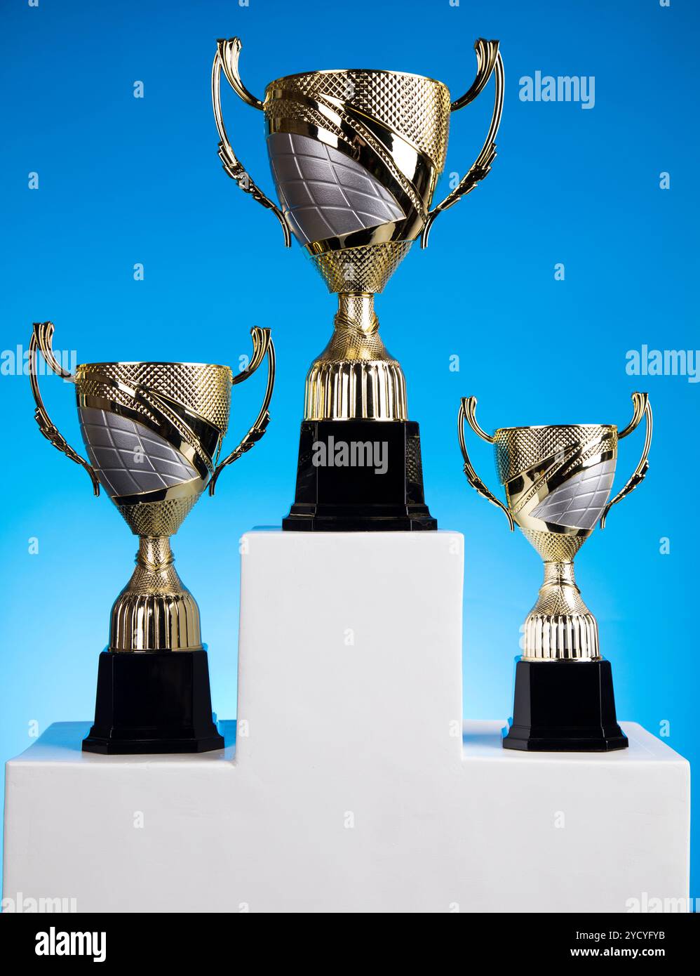 Sport podium, Cups of winners award Stock Photo - Alamy