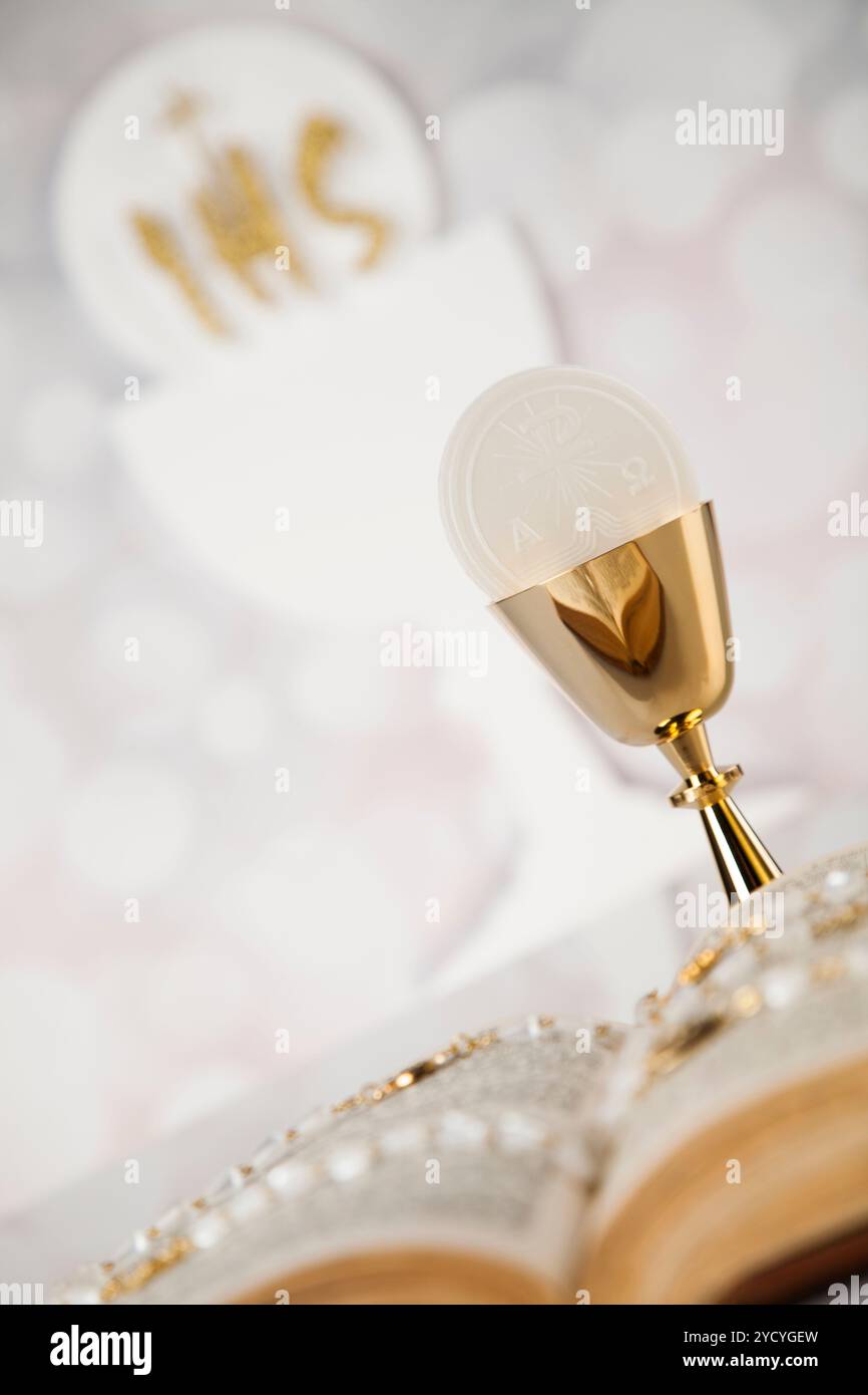 Holy communion a golden chalice with grapes and bread wafers Stock ...