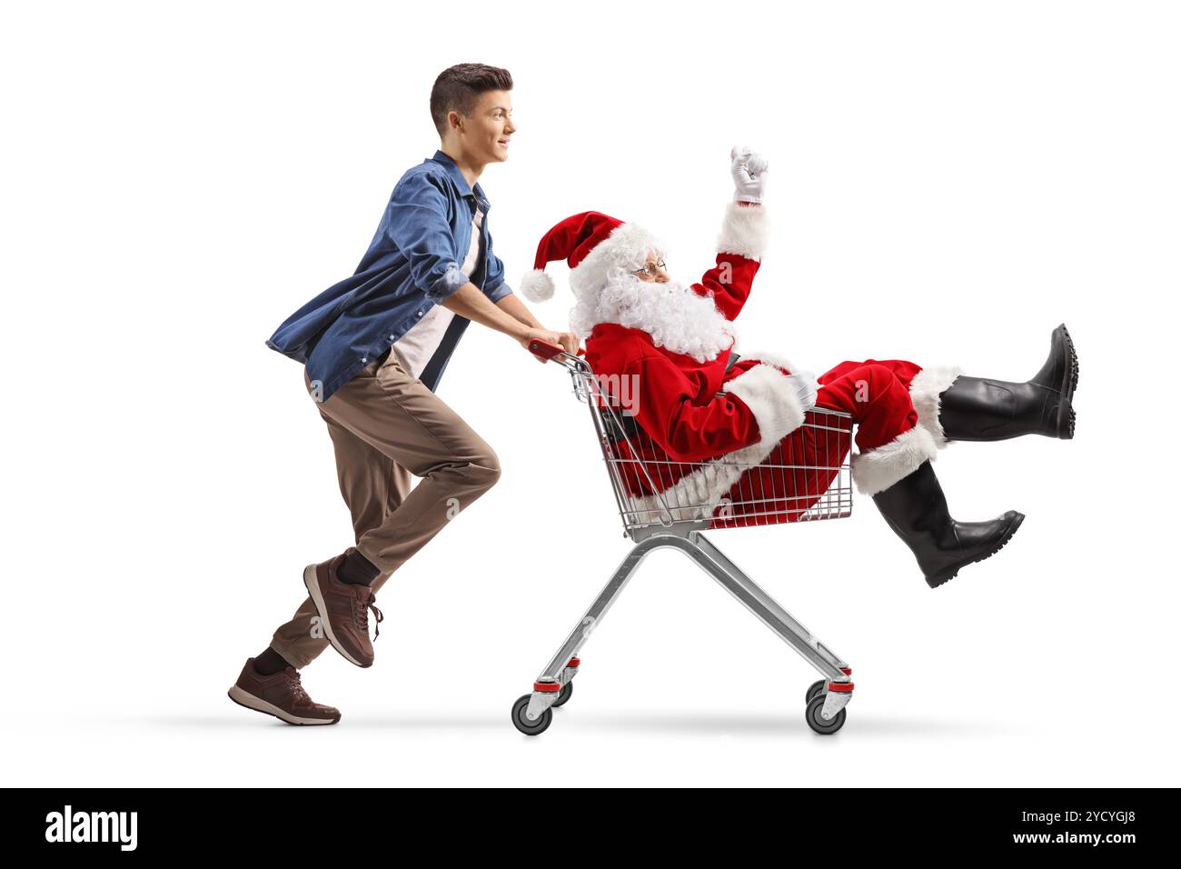 Young man pushing santa claus in a shopping cart isolated on white ...