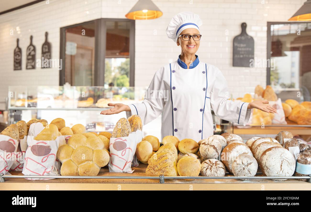 Female chef with freshly baked breads in a bakery Stock Photo - Alamy