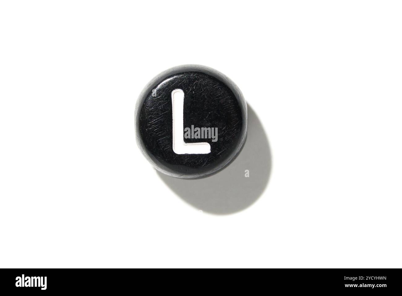 Black keyboard key with white letter l on white background: minimalist ...